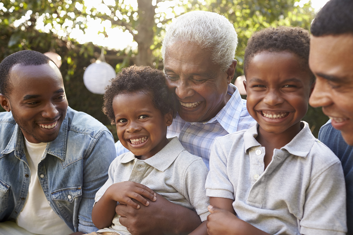 Multi Generation Male Family Members Gathered In A Garden Pancreatica multi-generation-male-family-members-gathered-in-a-garden-pancreatica